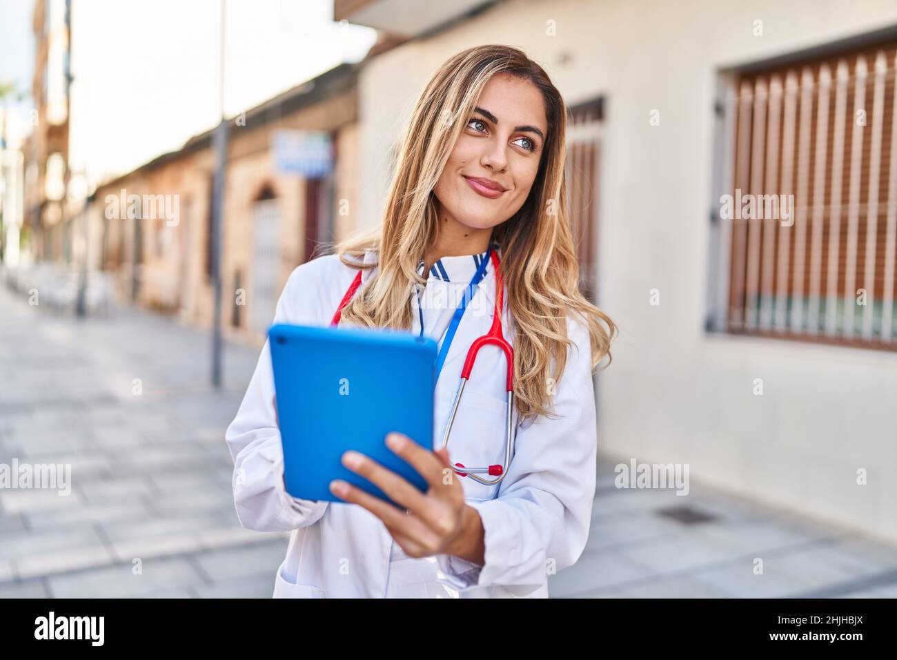 Woman doctor using tablet outside hi-res stock photography and images ...