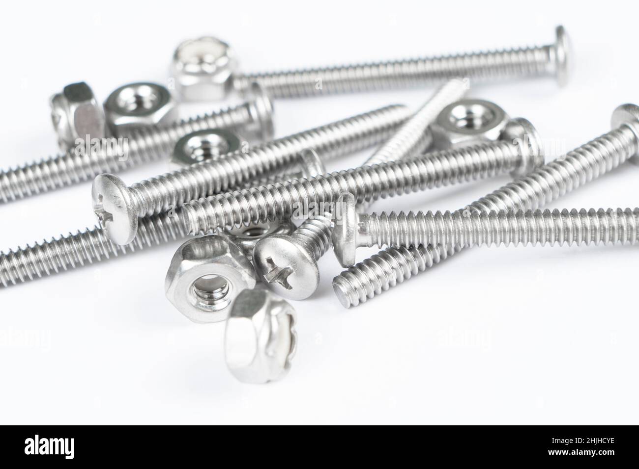 Metal bolts and nuts in a row background. Chromed screw bolts and nuts ...