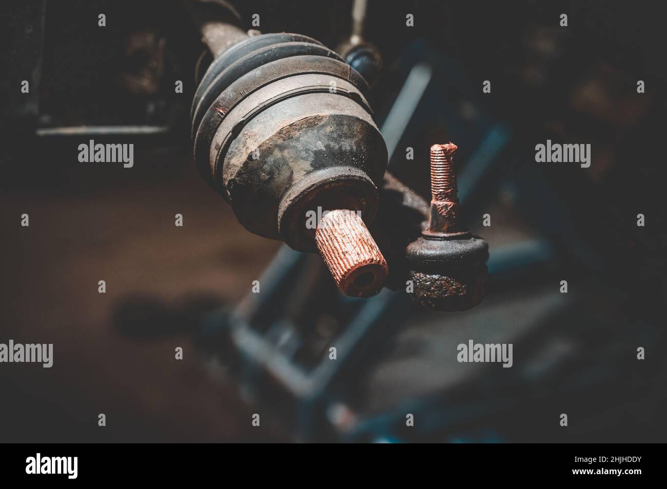 Closeup of an old rusty drive shaft in a workshop Stock Photo - Alamy