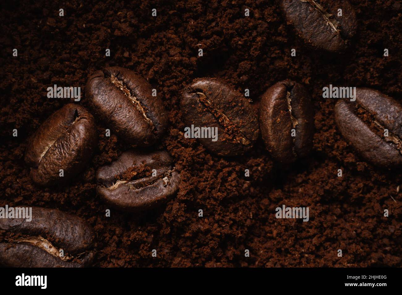 Macrophotography. mixture of coffee beans and ground coffee. view from ...