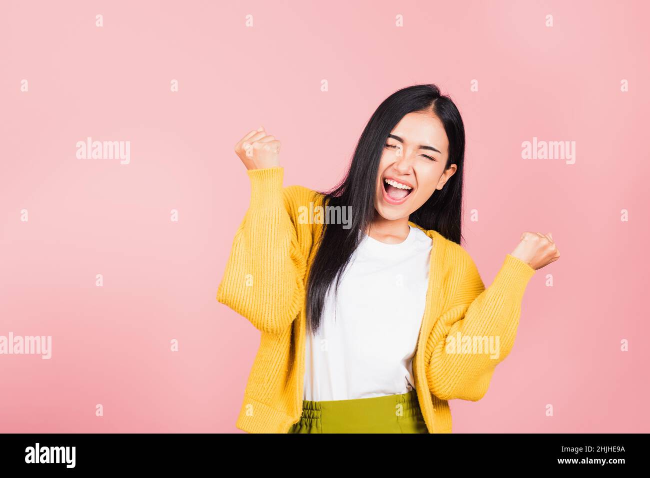 Happy Asian portrait beautiful cute young woman standing winning and ...