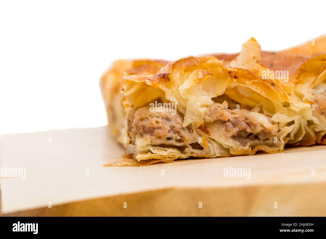 Closeup of sliced cake with chicken meat as a balkan cuisine. Isolated ...