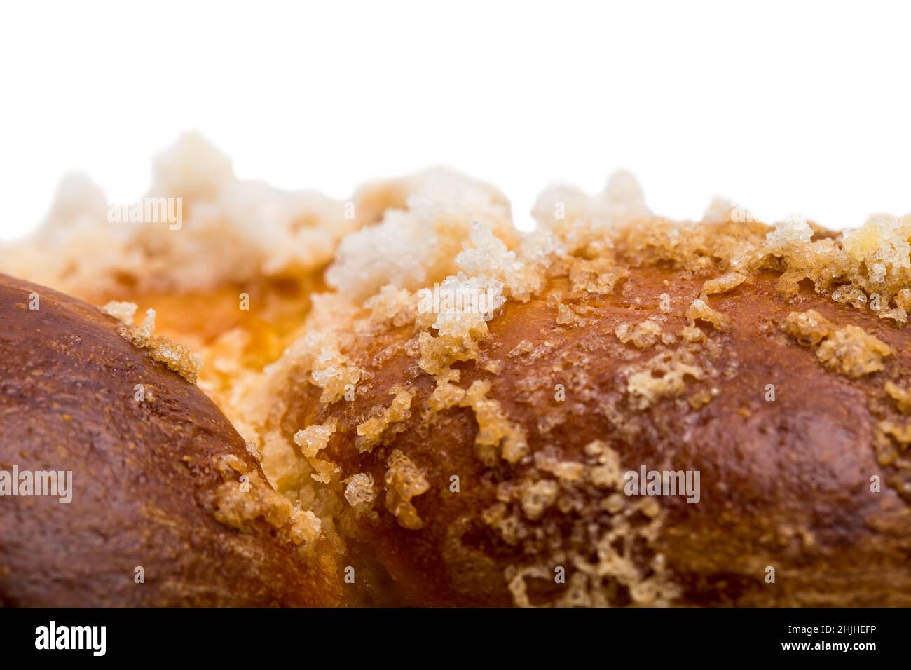 Sweet braided bread with crunchy sugar. Macro. Can be used as a whole ...