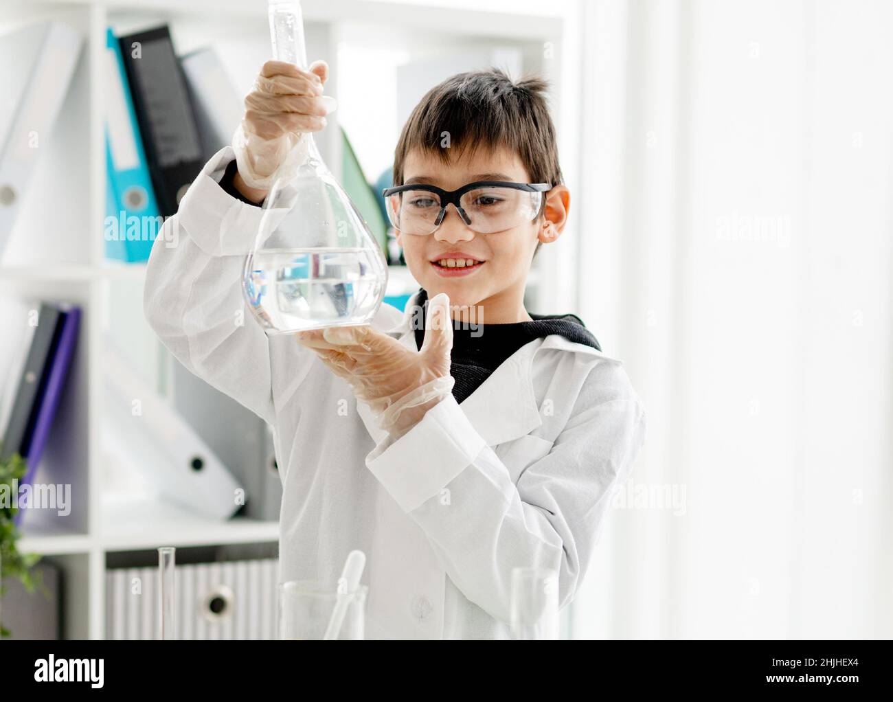 School boy in chemistry class Stock Photo - Alamy