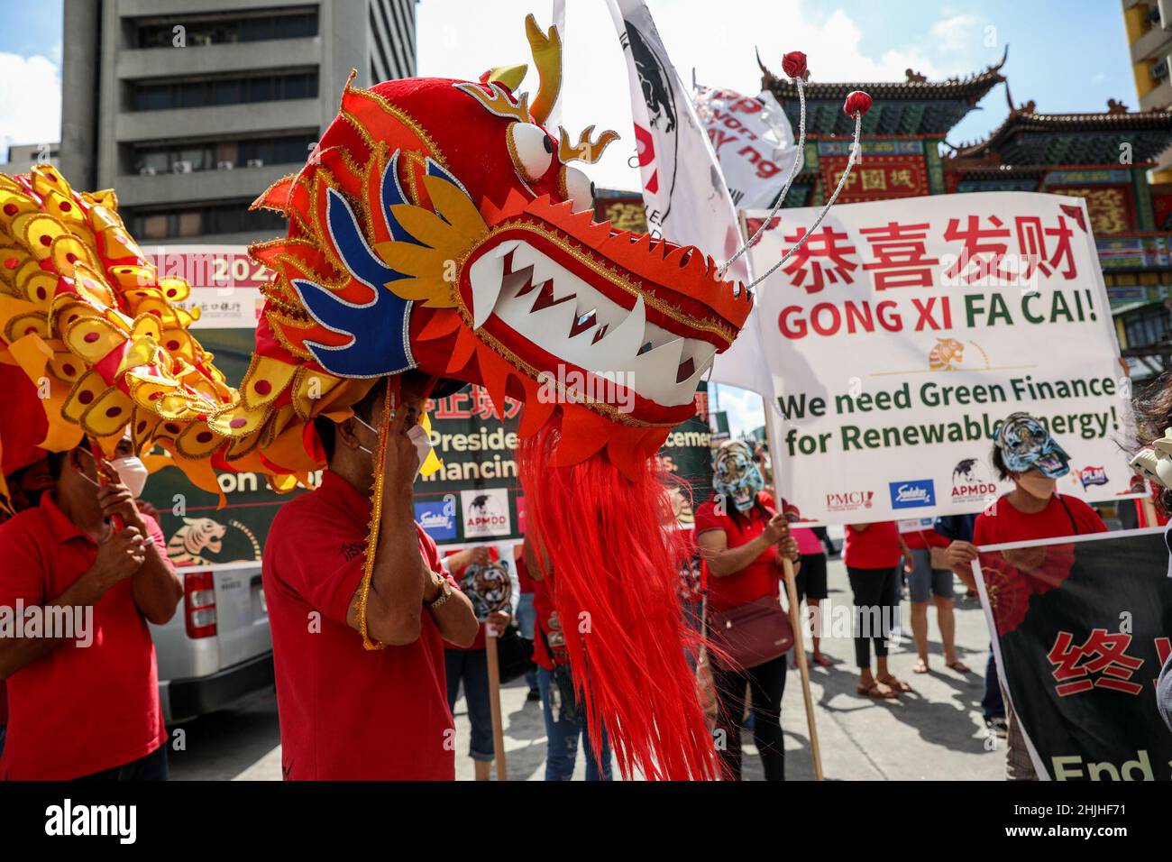 Manila, Philippines. 30th Jan, 2022. Climate activists perform a dragon ...