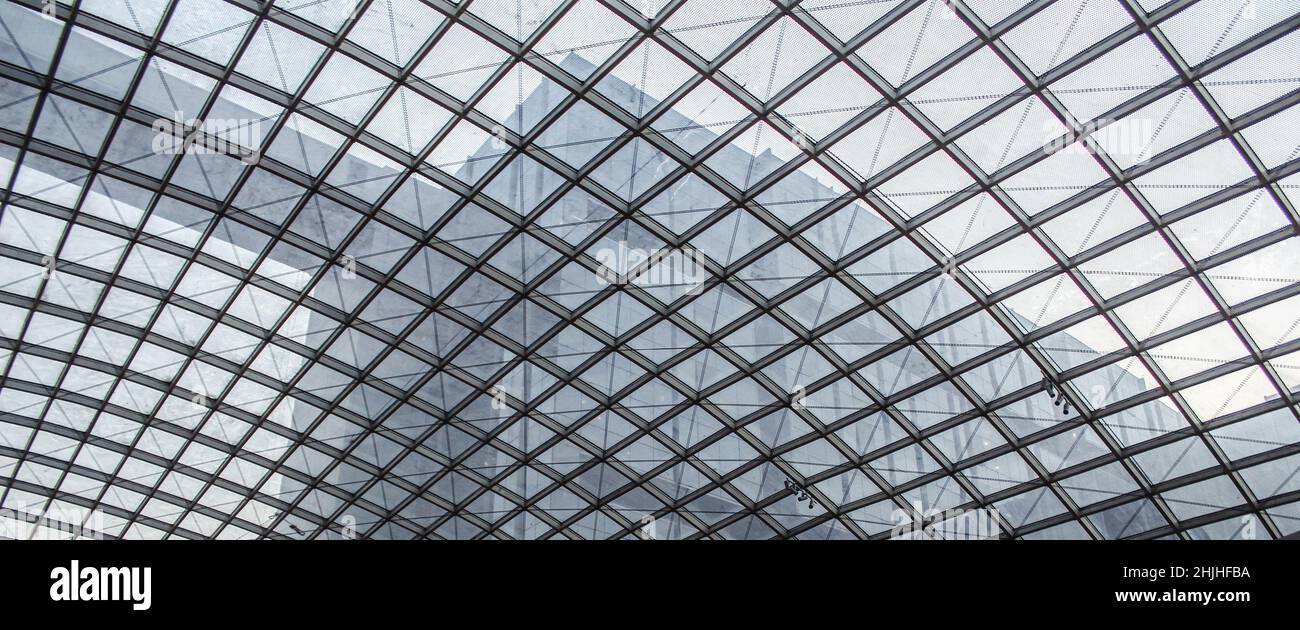Modern building with a curving roof and glass steel columns Stock Photo ...