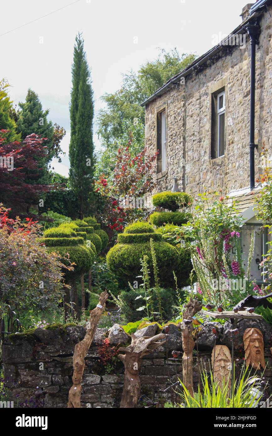 Decorative garden around the house Stock Photo - Alamy