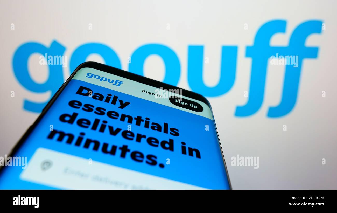 Mobile phone with webpage of American delivery company GoBrands Inc ...