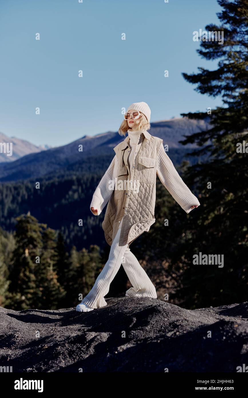 young woman standing on the top of the mountain forest lifestyle Stock ...