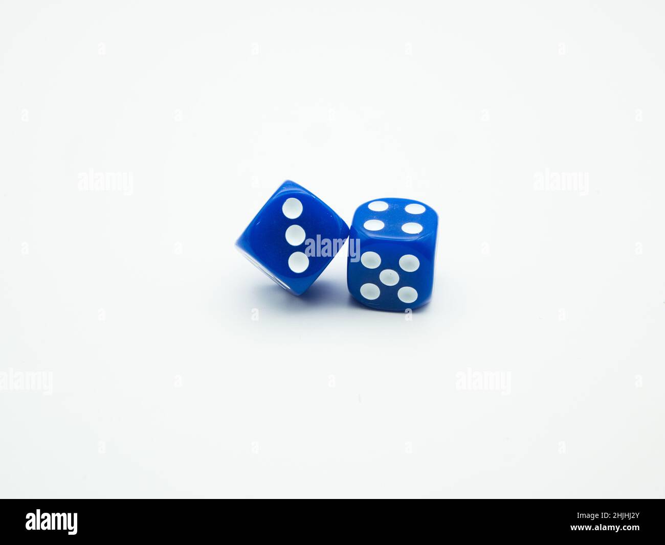 Two blue dice isolated on white background Stock Photo - Alamy