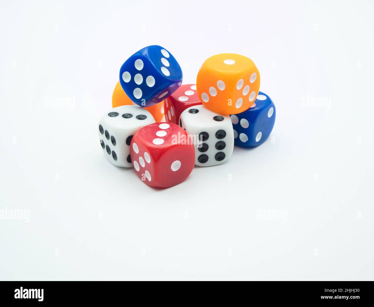 Mixed color of dice isolated on white background Stock Photo - Alamy