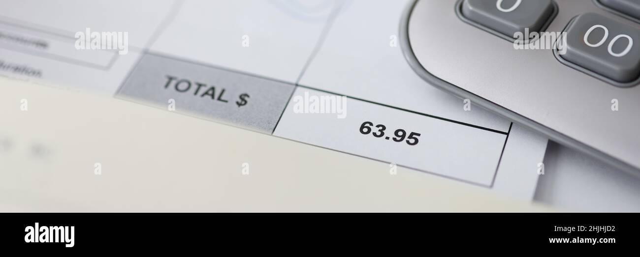 Paid goods and calculator on counting paper for time-based payments in ...
