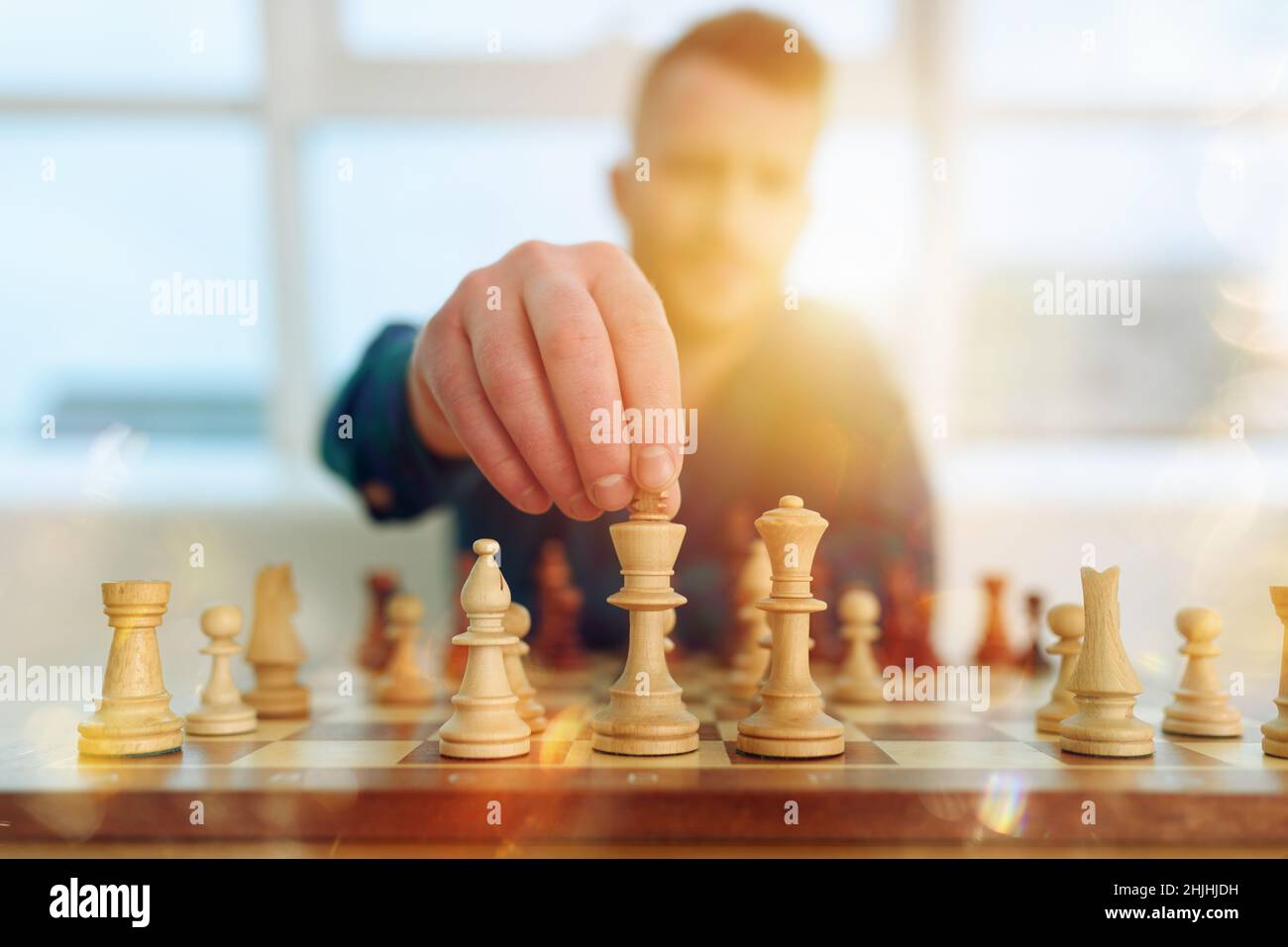 Businessmen play chess as strategy and tactic concept Stock Photo - Alamy