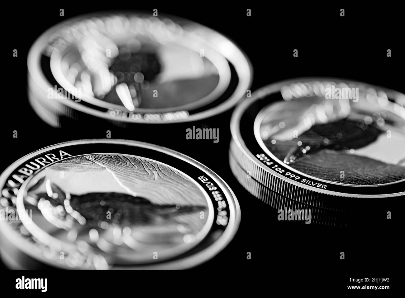 Macro Close up of Silver Bullion Coin on a black mirror background ...