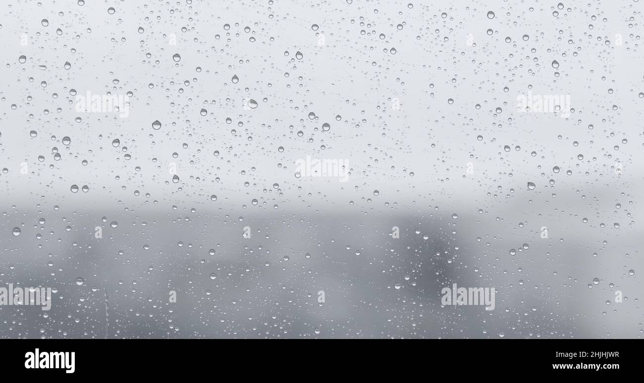 background with raindrops on window glass, wide photo Stock Photo - Alamy