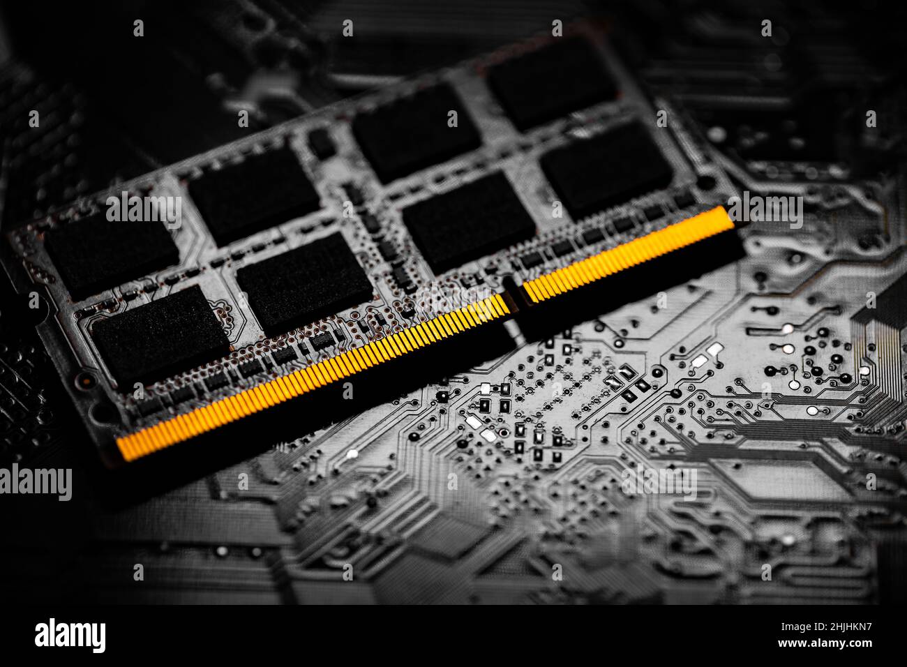 Macro Close up of computer RAM chip and motherboard on dark background ...