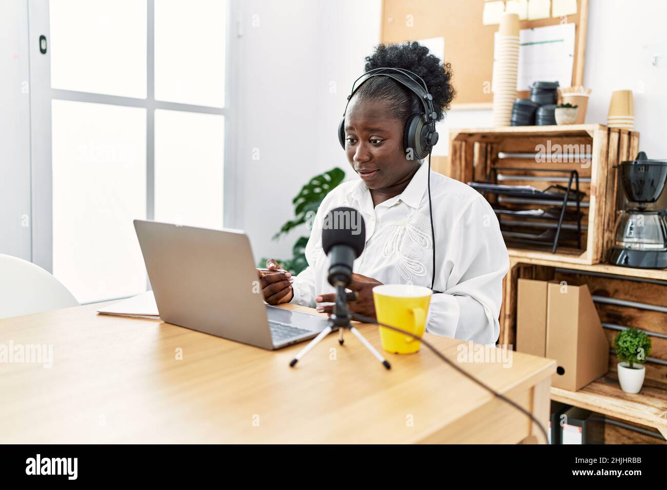 Young african american woman broadcaster smiling confident working at ...