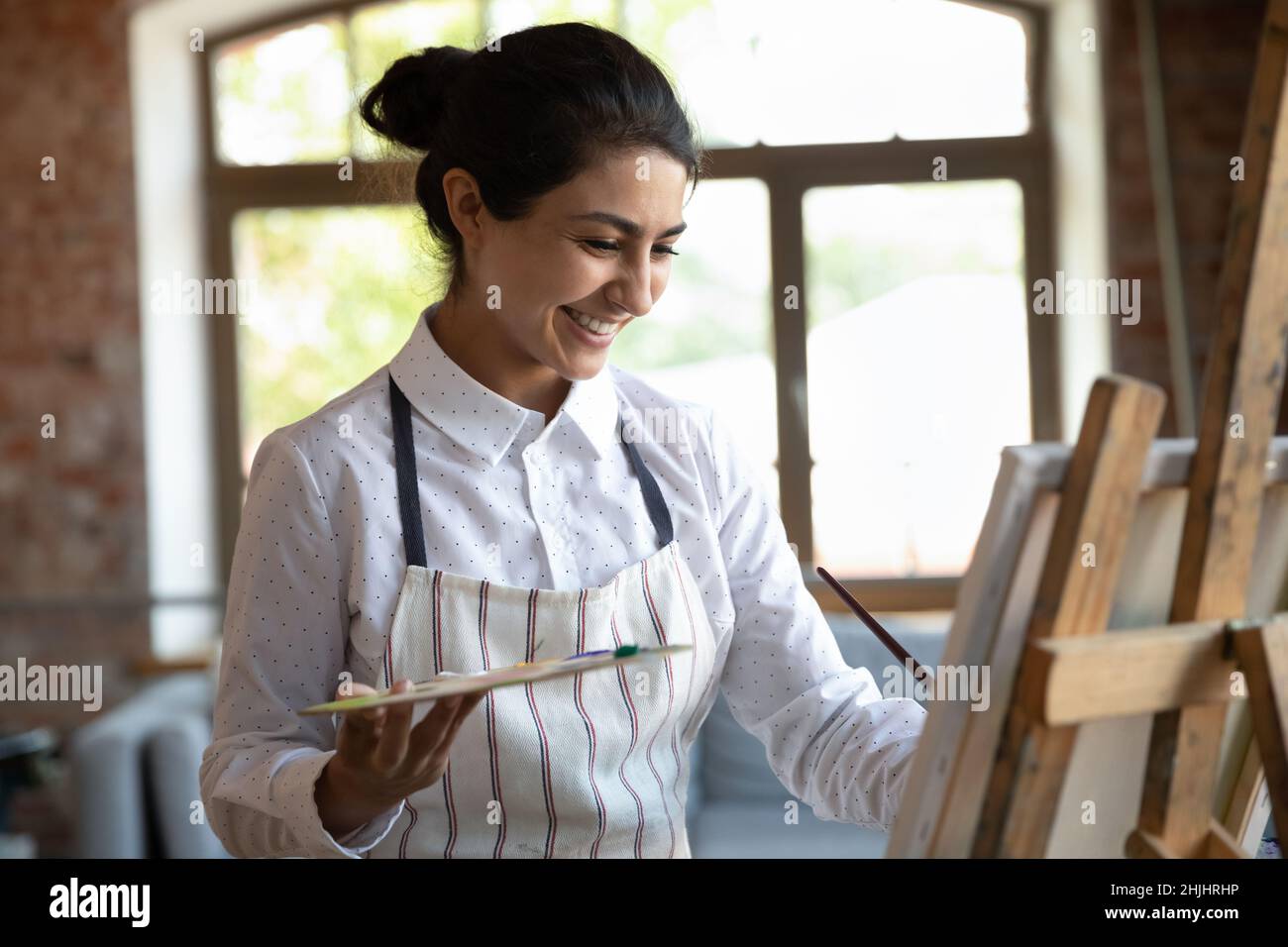 Happy Indian artist student girl enjoying creative hobby Stock Photo ...