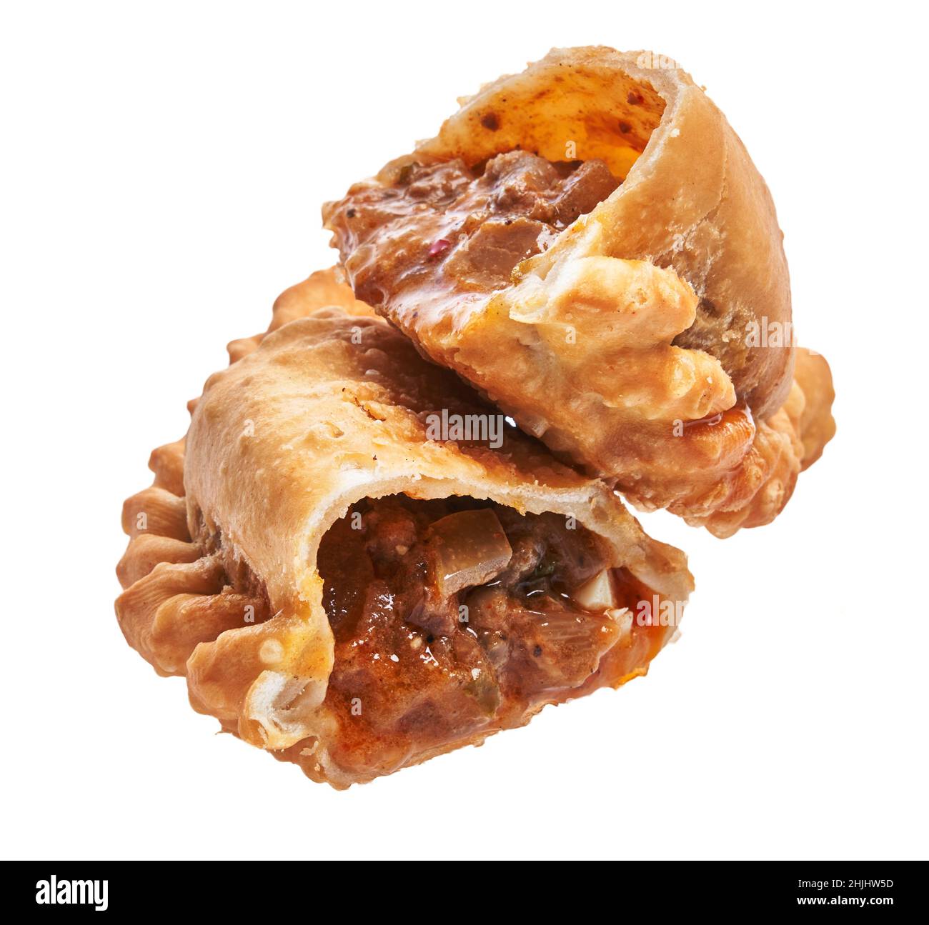 Two middle argentinian empanadas over white isolated background Stock ...