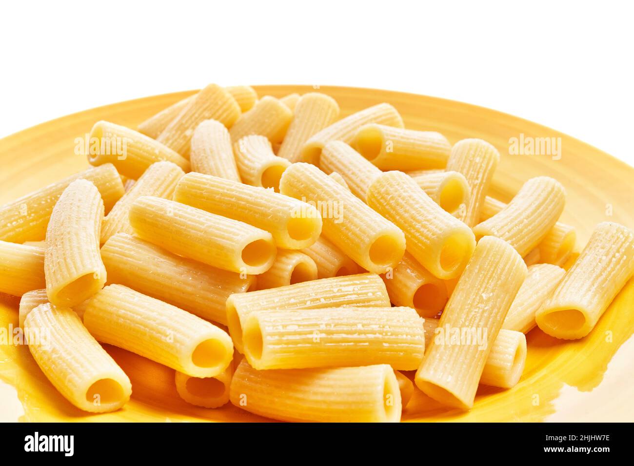 Plate of italian rigatoni pasta over white isolated background Stock ...