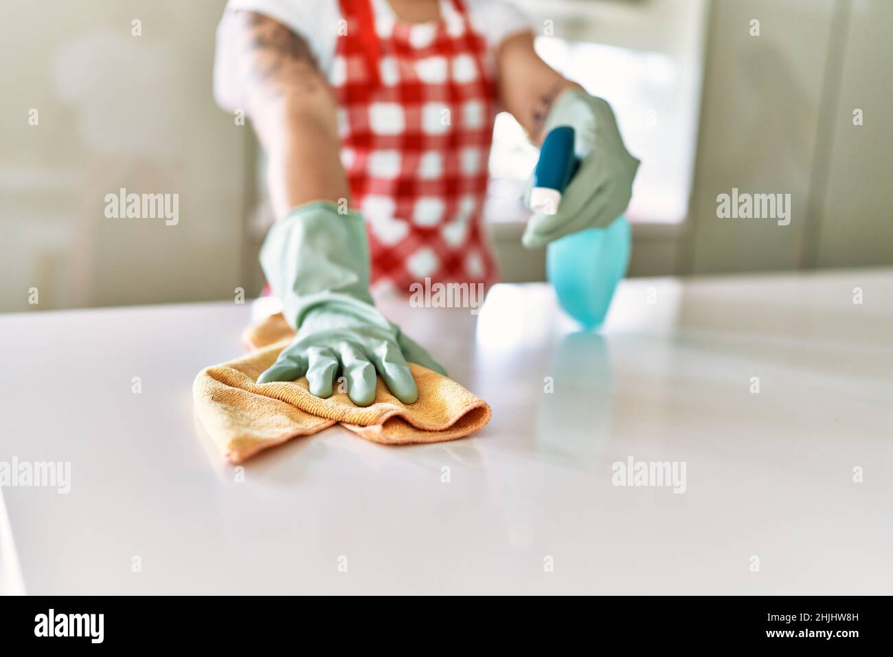 Girl cleaning table at the kitchen Stock Photo - Alamy
