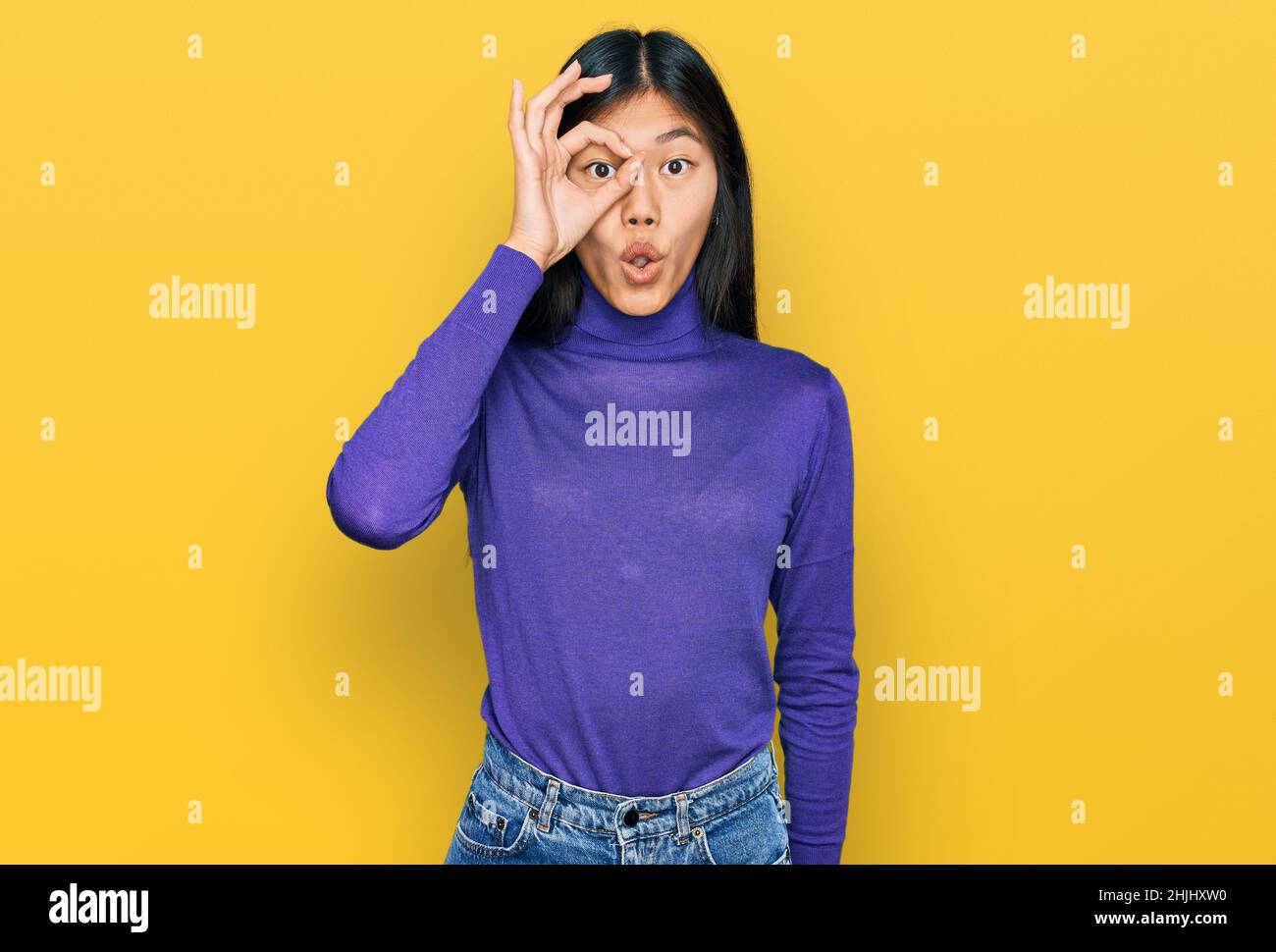 Beautiful young asian woman wearing casual clothes doing ok gesture ...