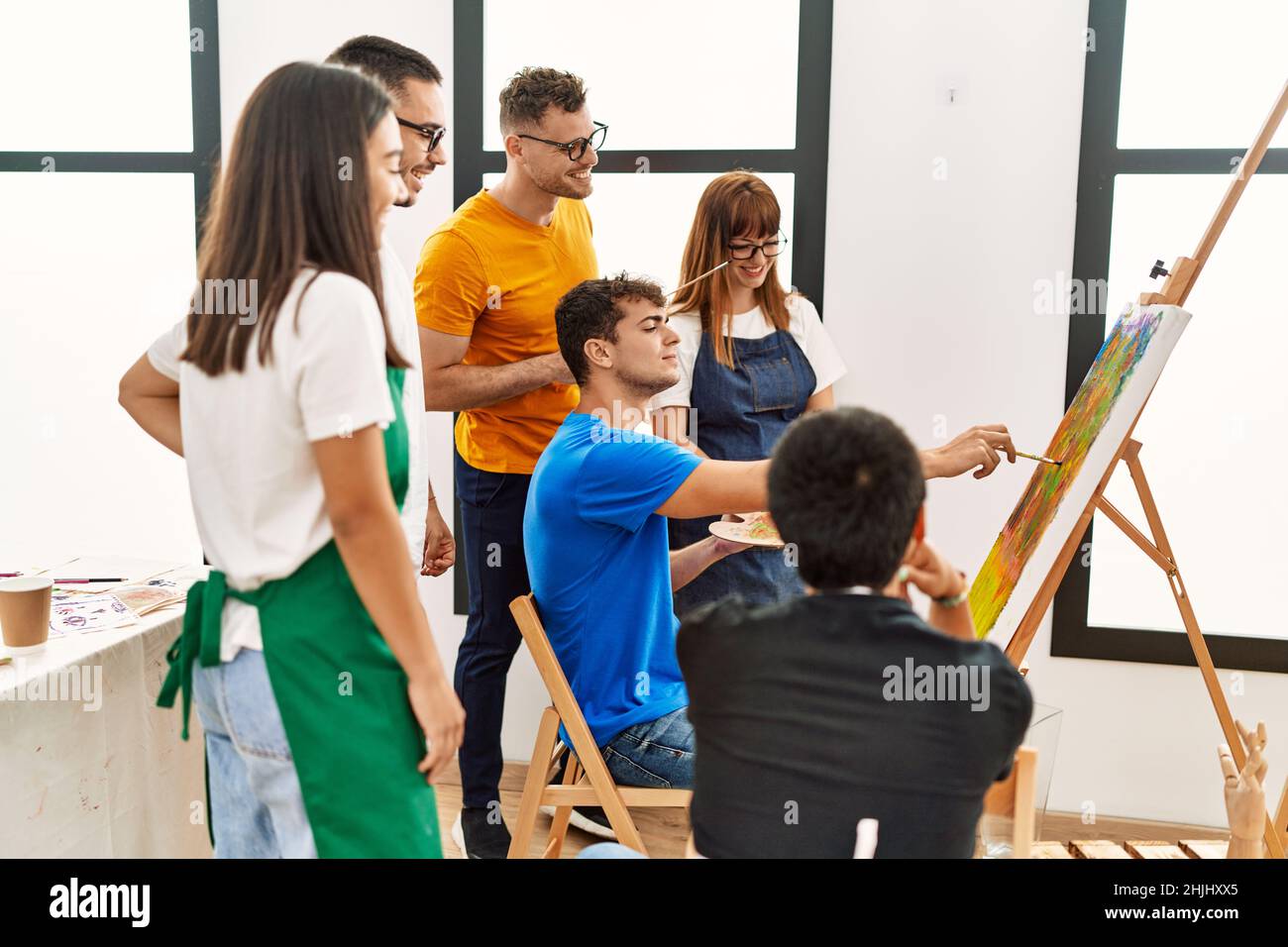 Group of people smiling happy drawing at art studio Stock Photo - Alamy