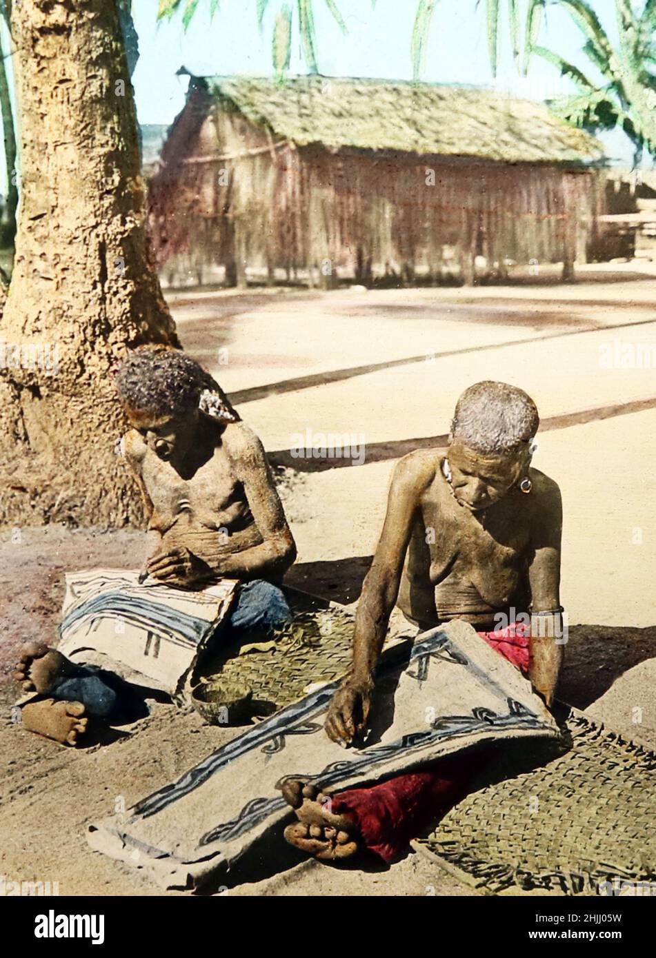 Women dress making in Papua New Guinea, Victorian period Stock Photo ...