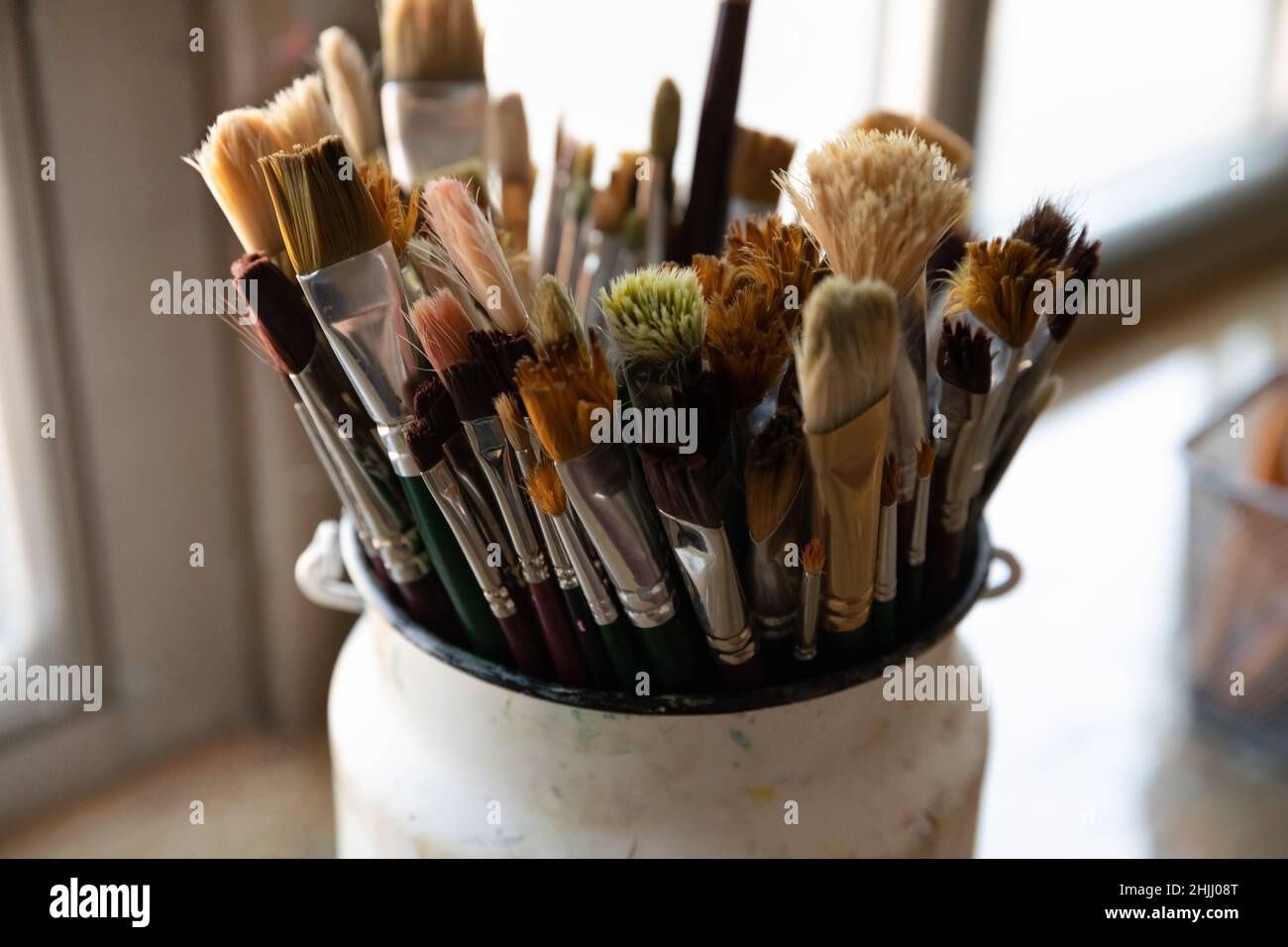 Bunch of paint brushes in metal bucket close up Stock Photo - Alamy