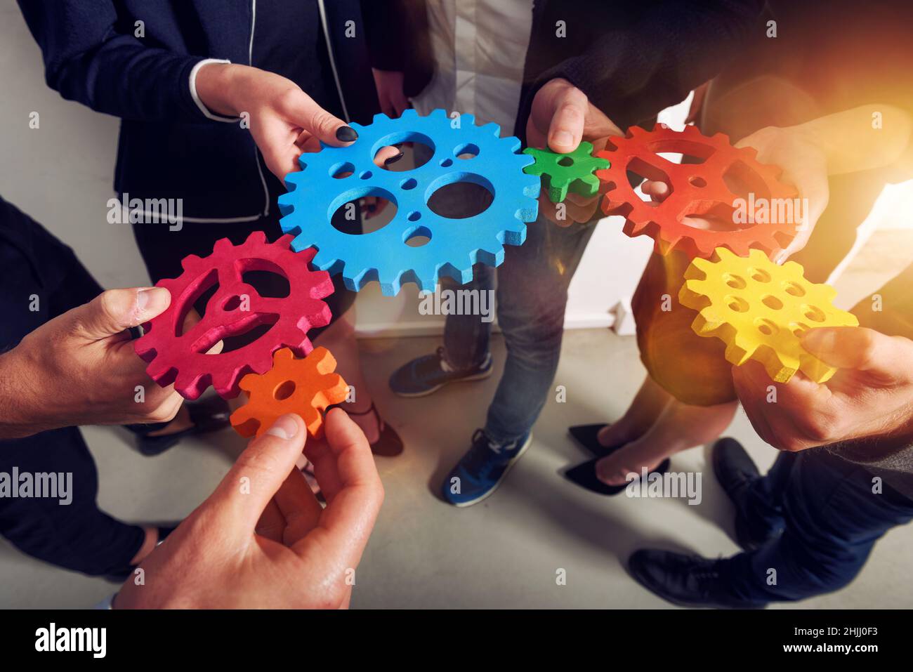 Business team connect pieces of gears as teamwork and partner Stock ...