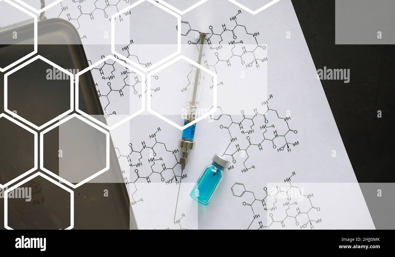 small jars with injection and syringe for injection on blue background ...