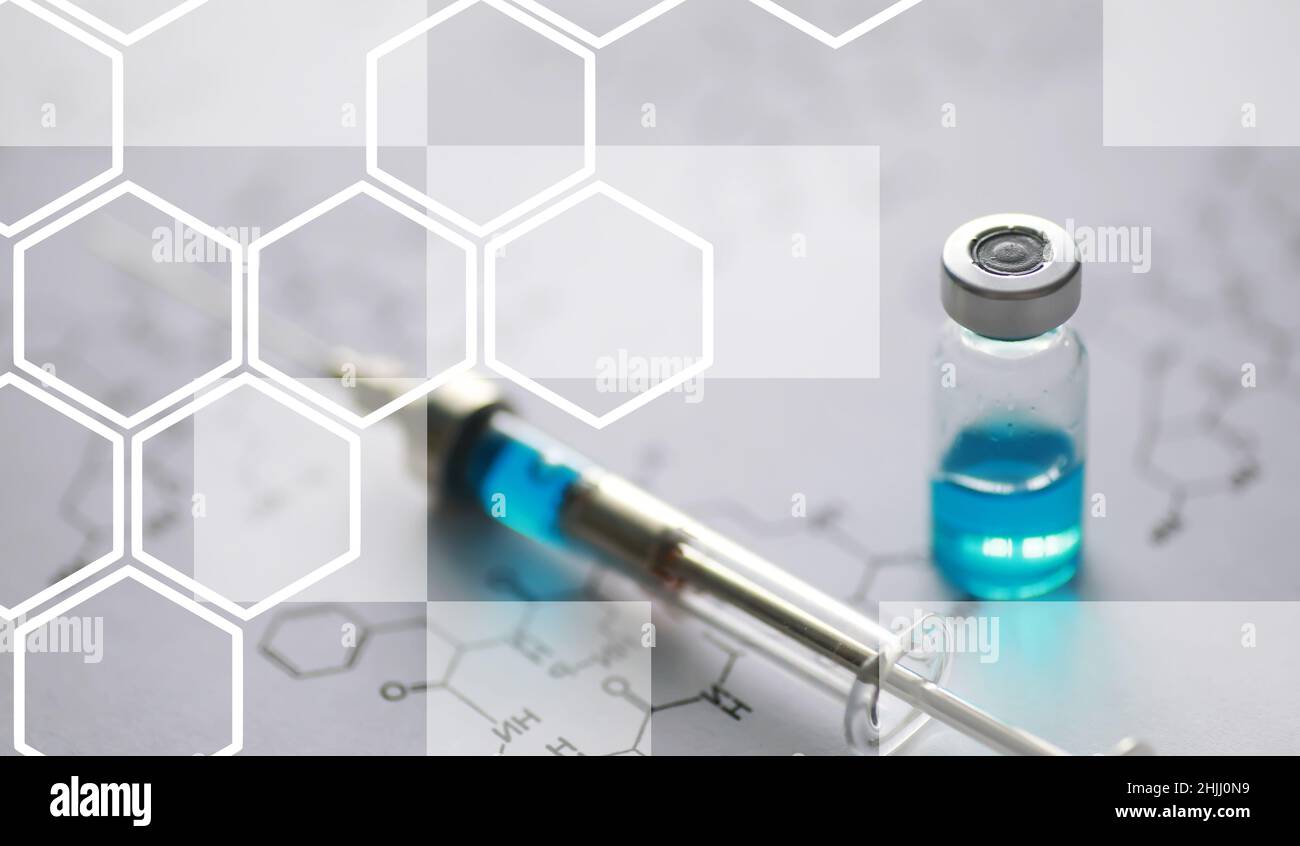 small jars with injection and syringe for injection on blue background ...