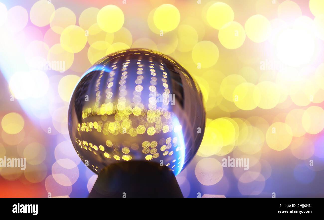 Crystal Ball on the floor with bokeh. Glass ball with colorful bokeh ...