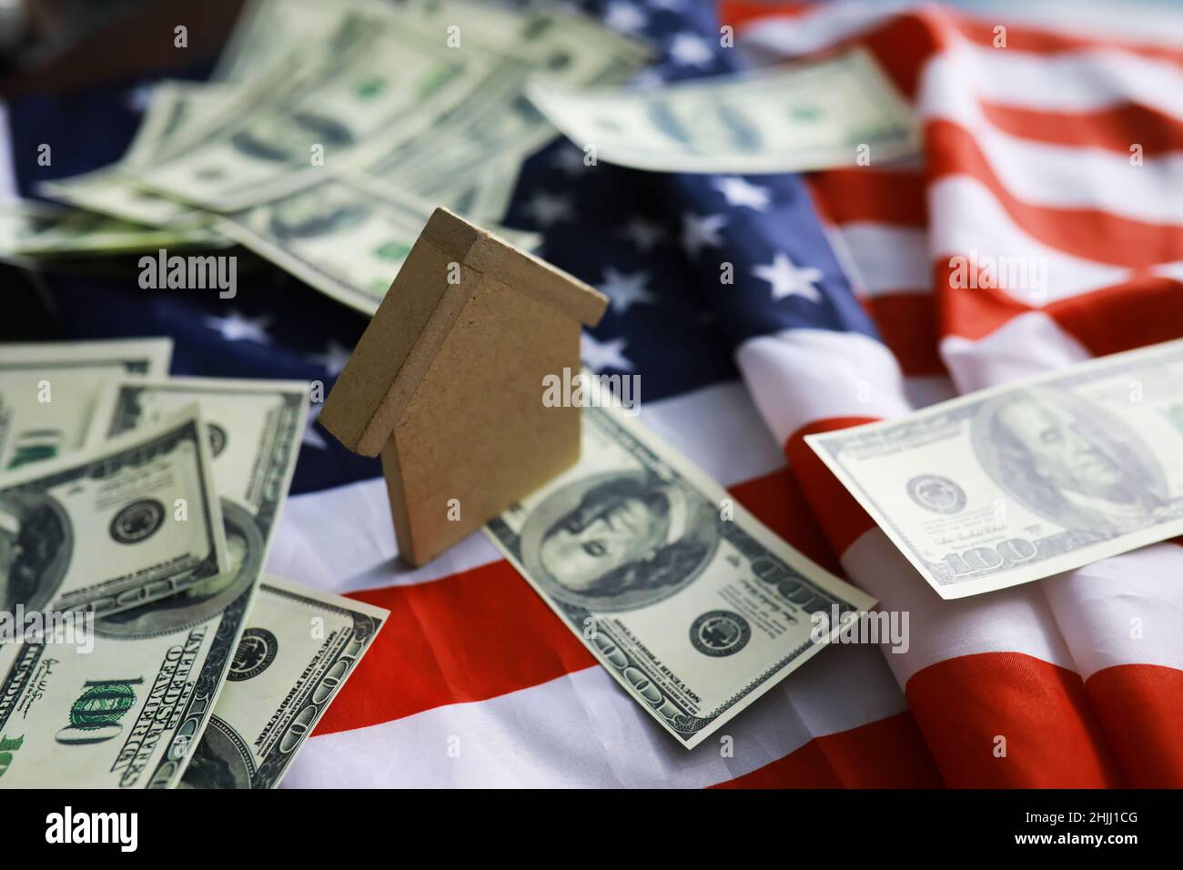 House symbol on American flag. Mortgage credit lending. Housing safety ...