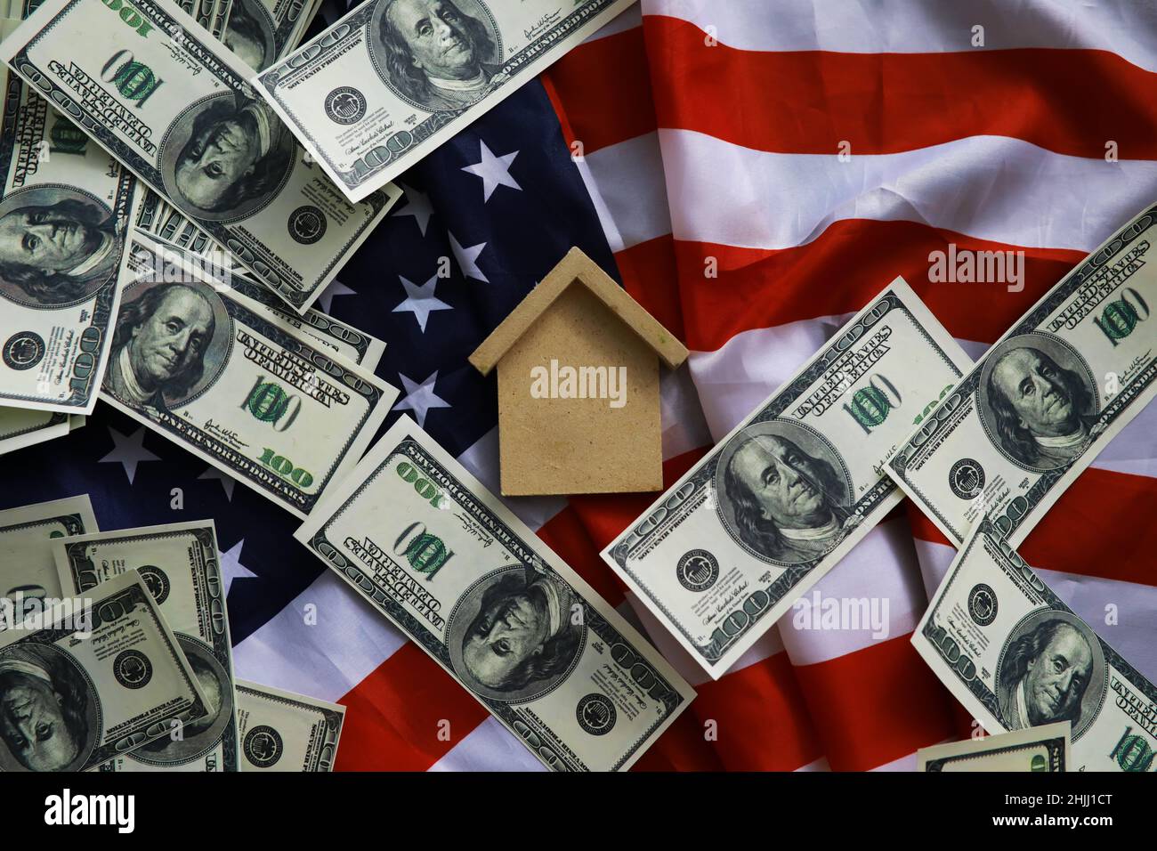 House symbol on American flag. Mortgage credit lending. Housing safety ...