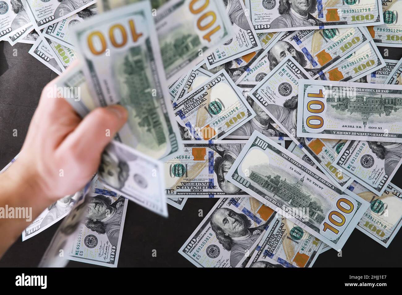 Cash money in a large pile as a finance background. Paper money close ...