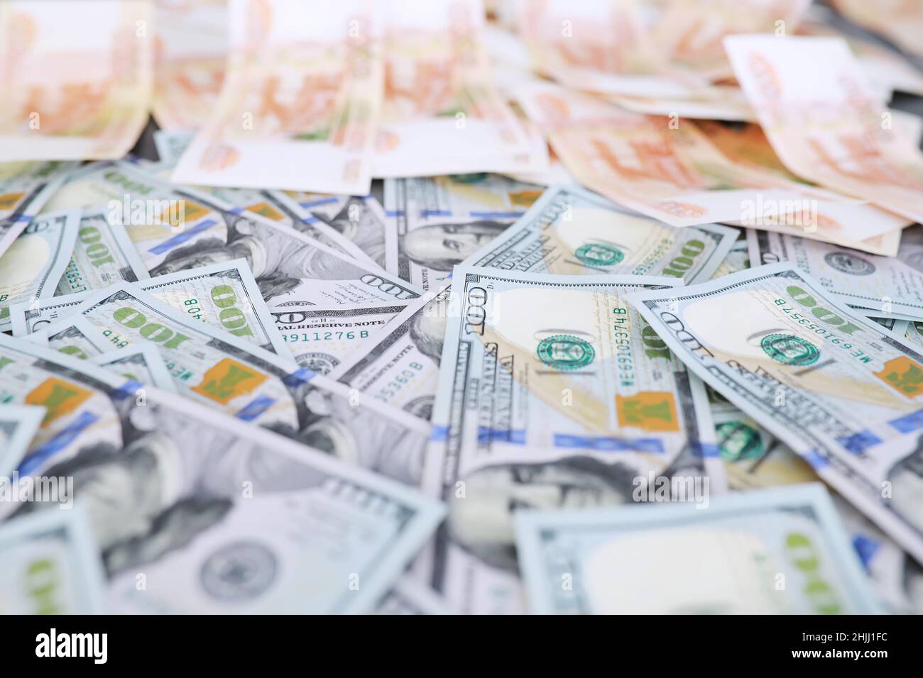 Cash money in a large pile as a finance background. Paper money close ...