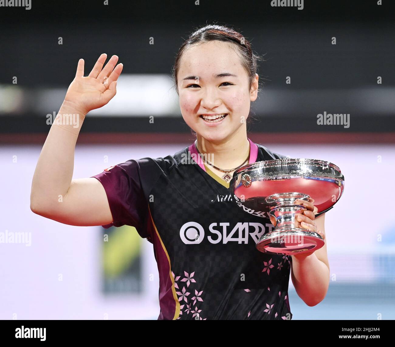Mima Ito poses with the trophy after defeating Hina Hayata in the women ...