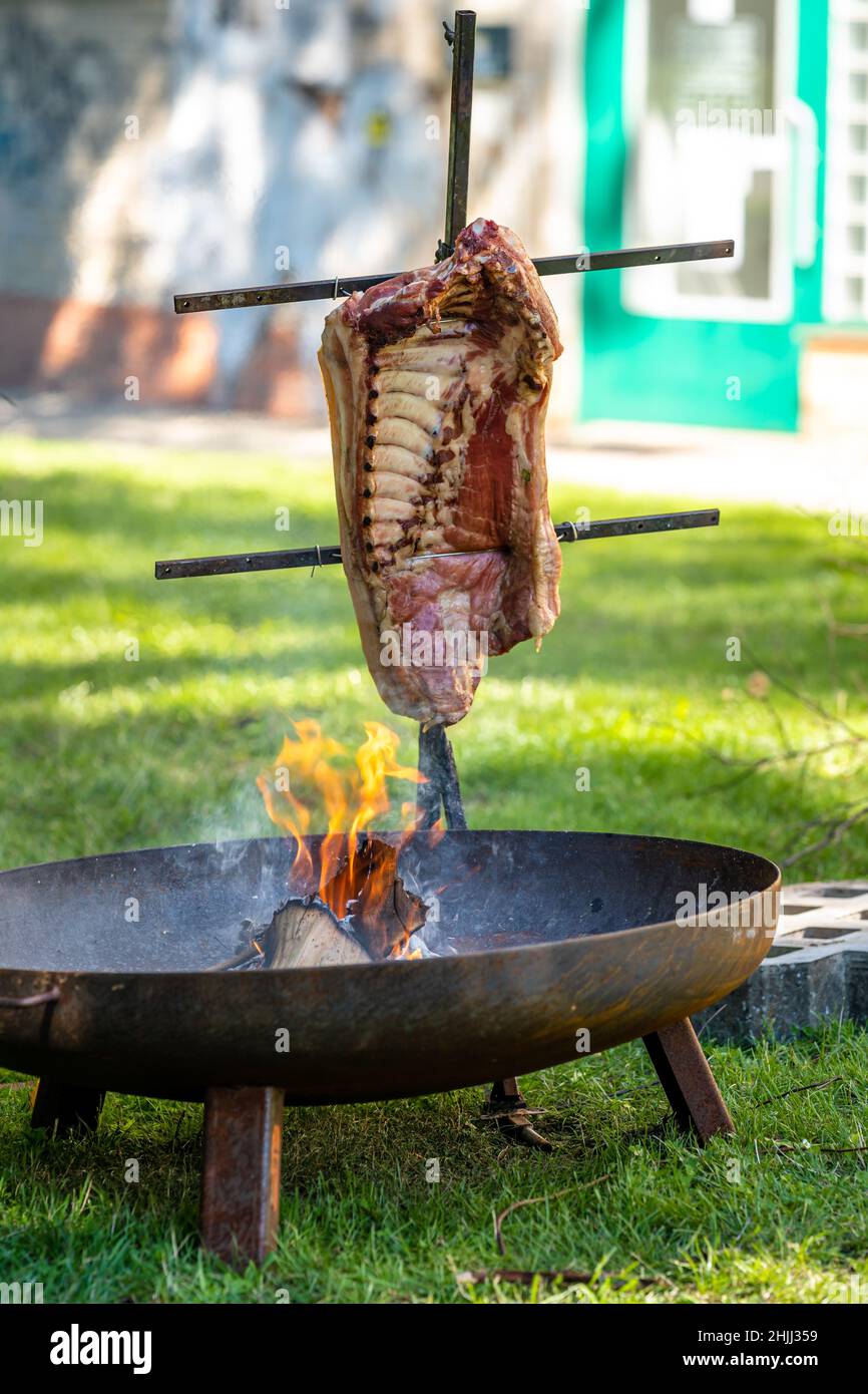 roasting meat on an open fire at a garden party Stock Photo - Alamy