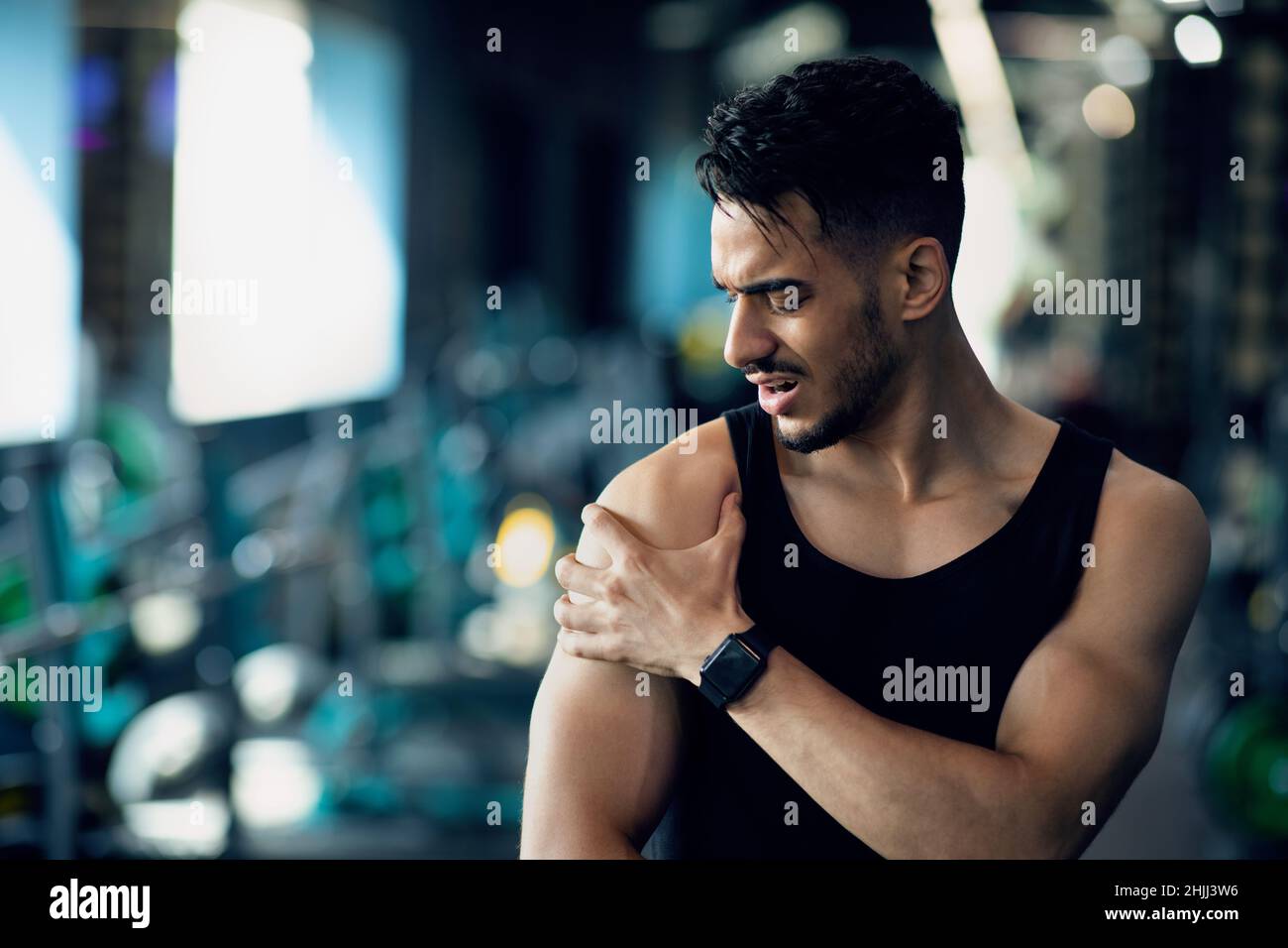 Sports Injury. Middle Eastern Man Suffering Shoulder Pain During ...