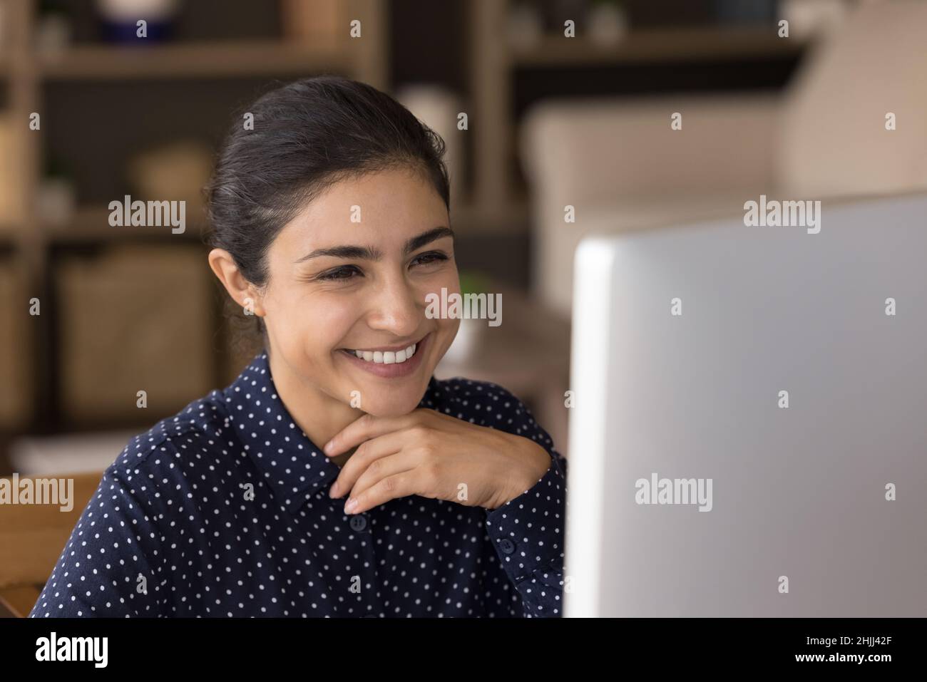 Smiling young Indian businesswoman working on computer in office Stock ...