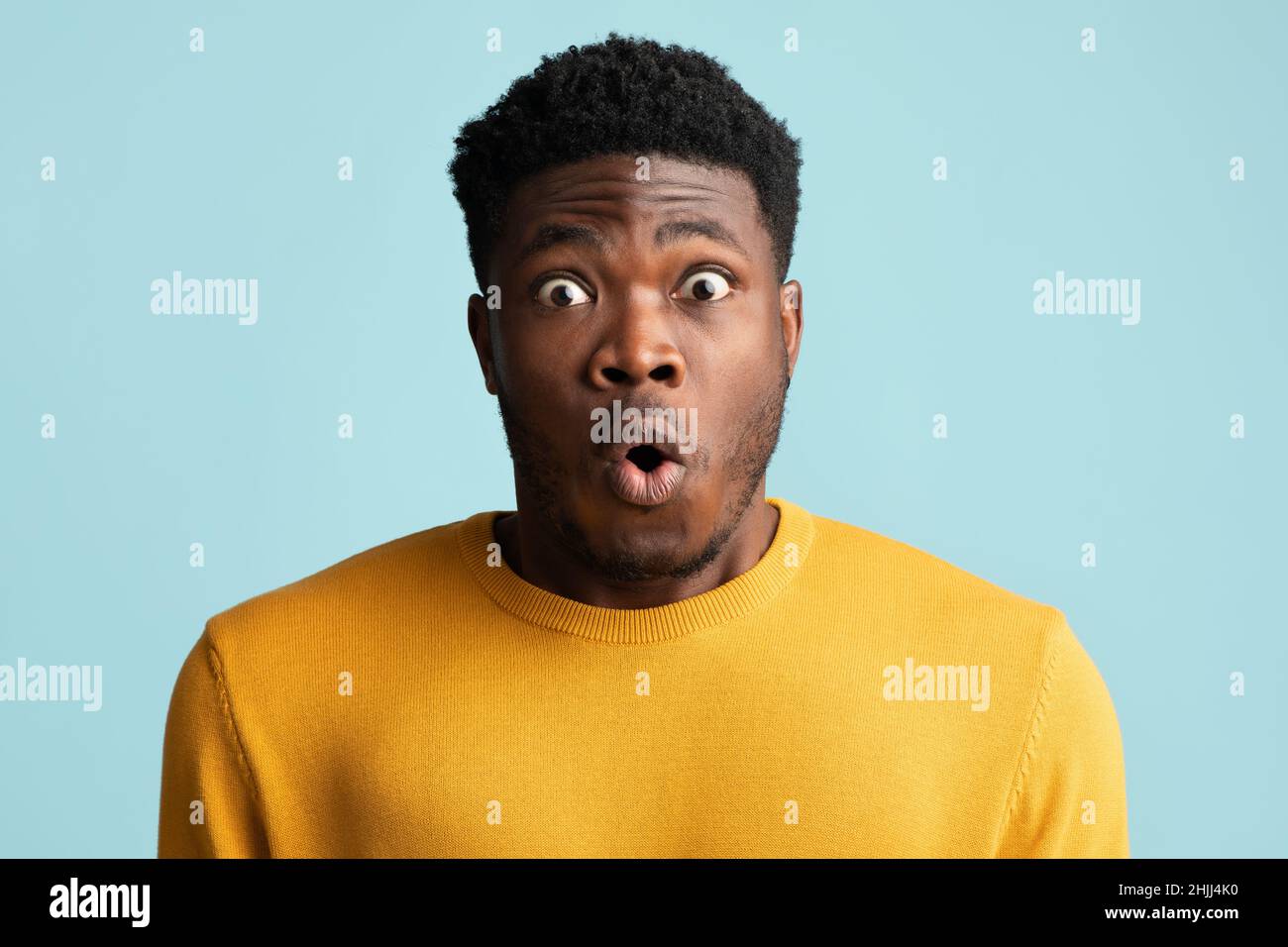 Photo shocked cheerful guy hi-res stock photography and images - Alamy