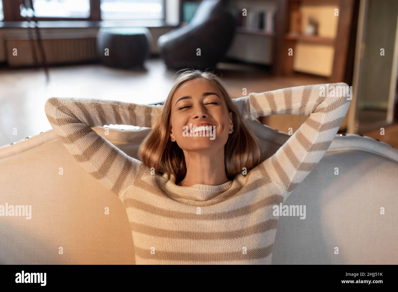 Calm woman having rest at home on the couch Stock Photo - Alamy