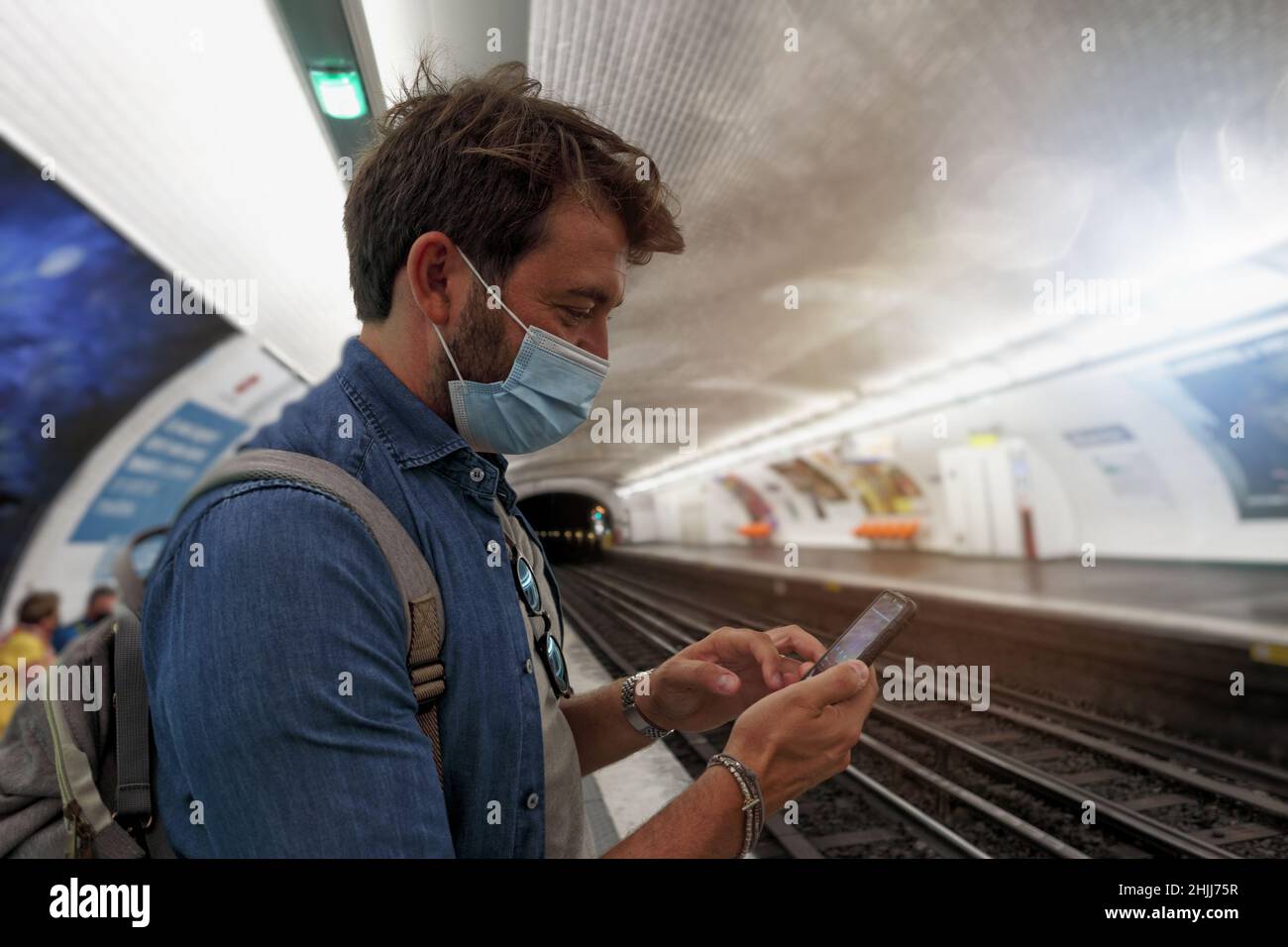 Man wait for the subway and plan his trip with smartphone Stock Photo ...