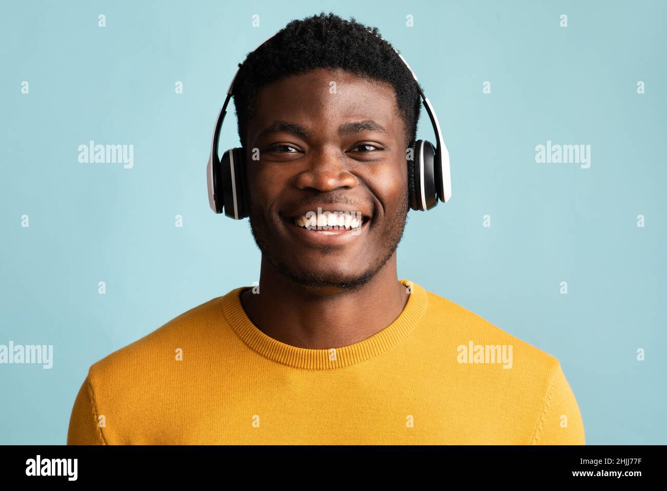 Happy african american guy headphones hi-res stock photography and ...