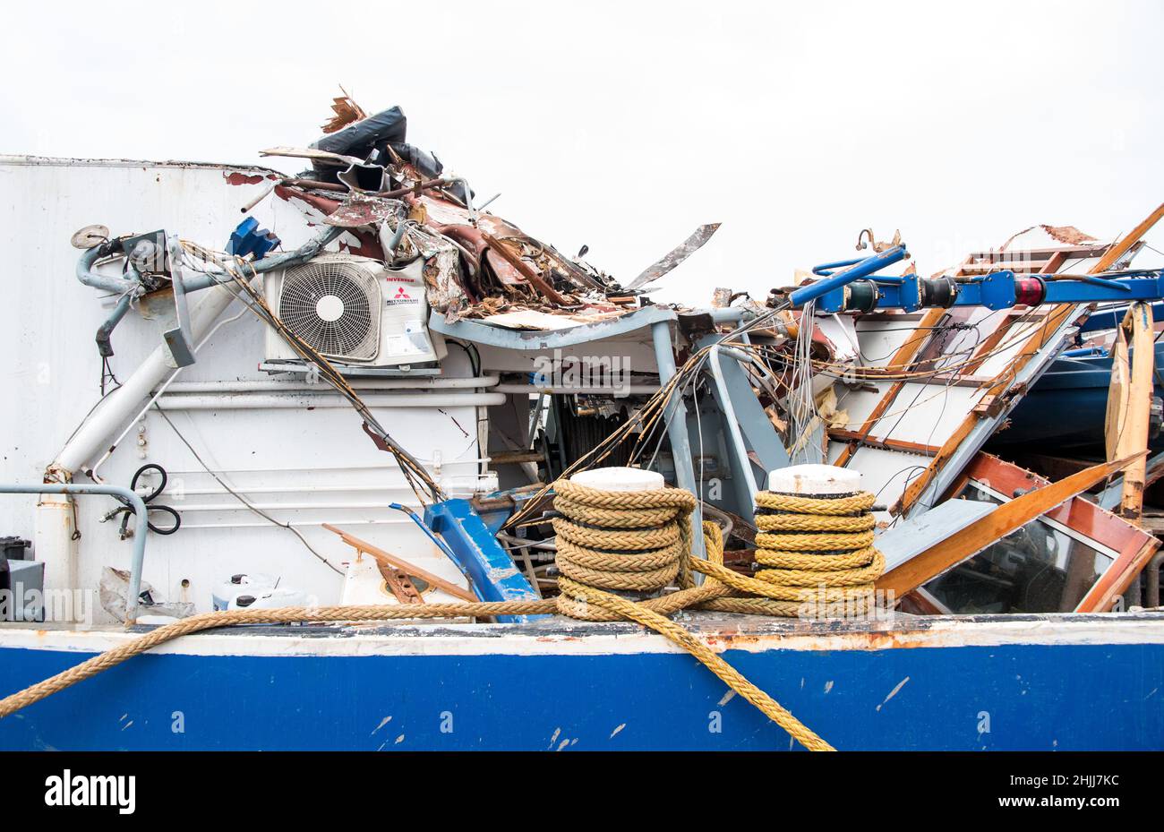 Hamburg, Germany. 30th Jan, 2022. A barge lies damaged in the harbor ...