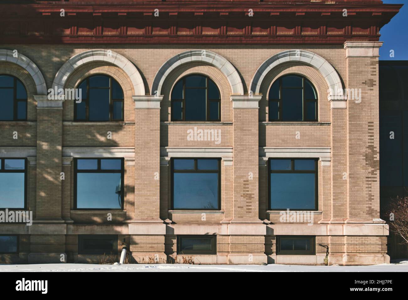 Modern brick building with arch windows Stock Photo - Alamy