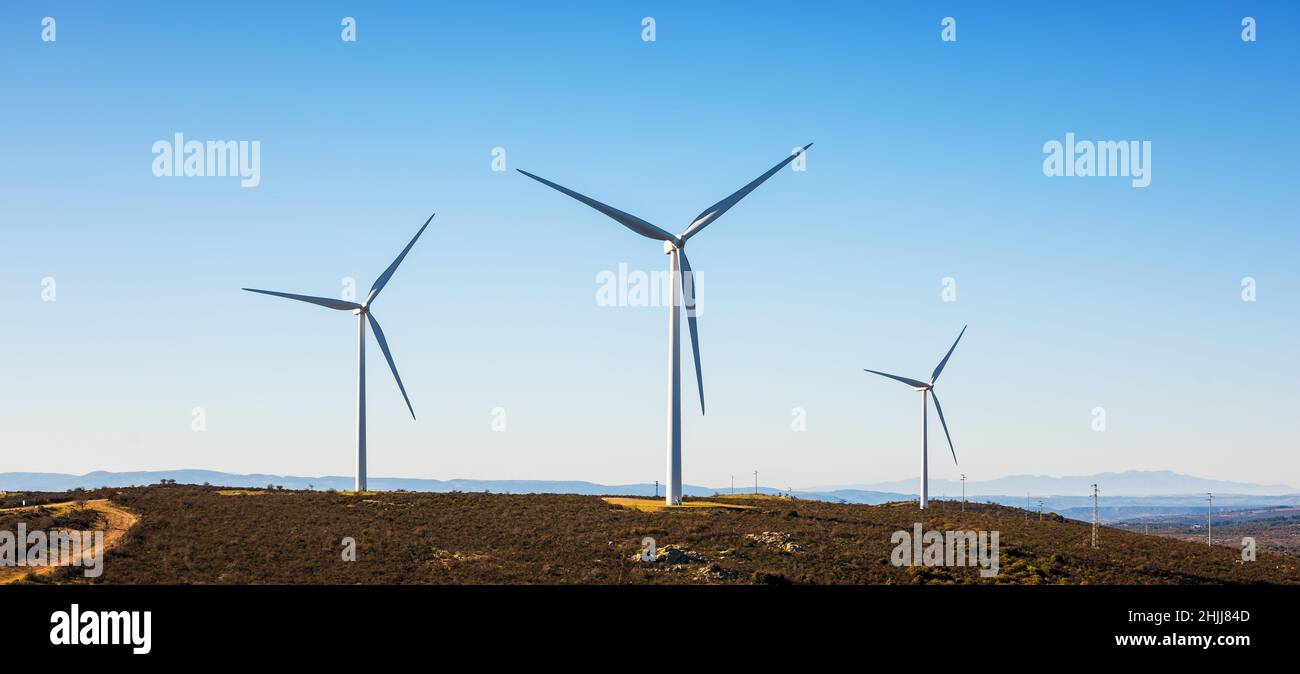 Wind turbines on a beautiful blue sky in a mountain wind farm in ...