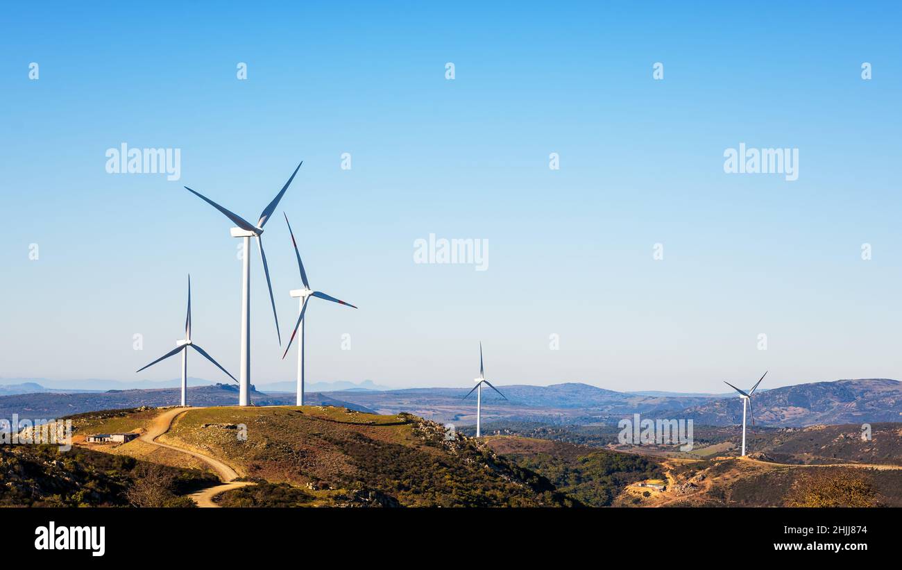 Wind turbines on a beautiful blue sky in a mountain wind farm in ...