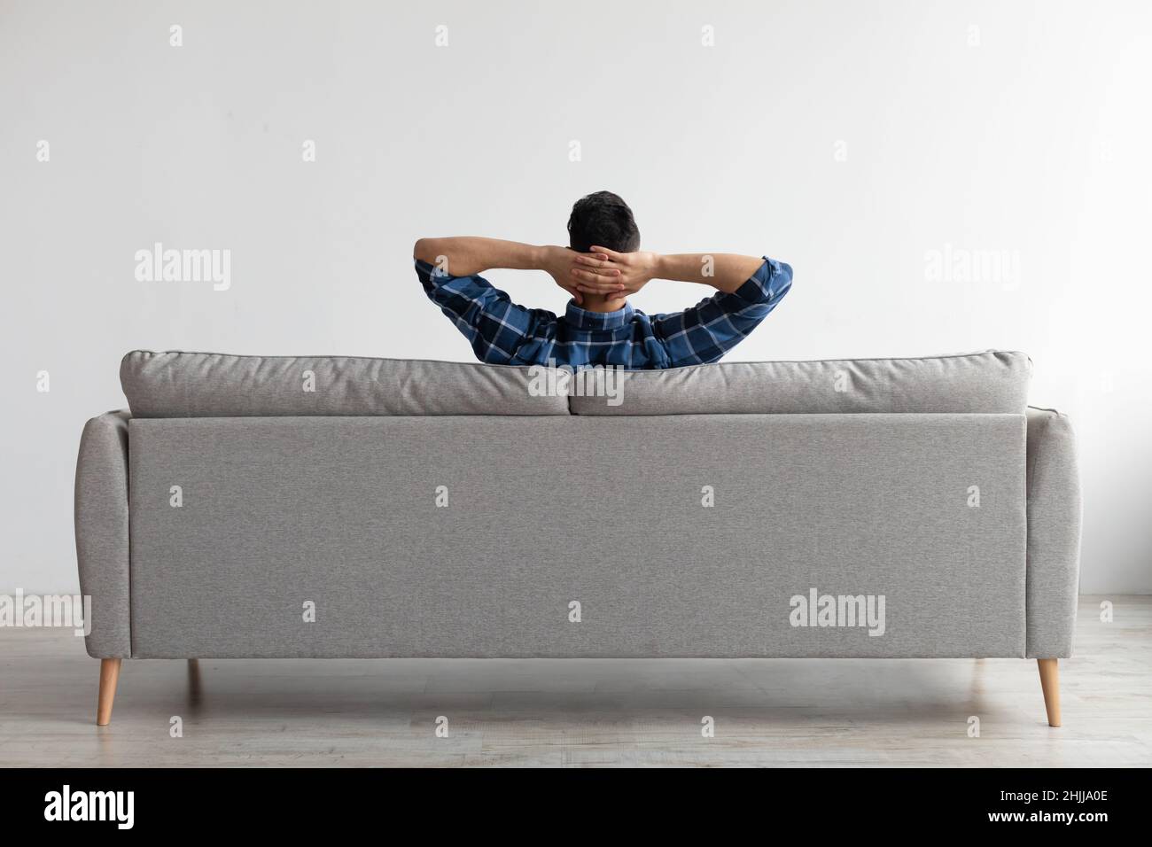 Man having rest at home on the couch Stock Photo - Alamy